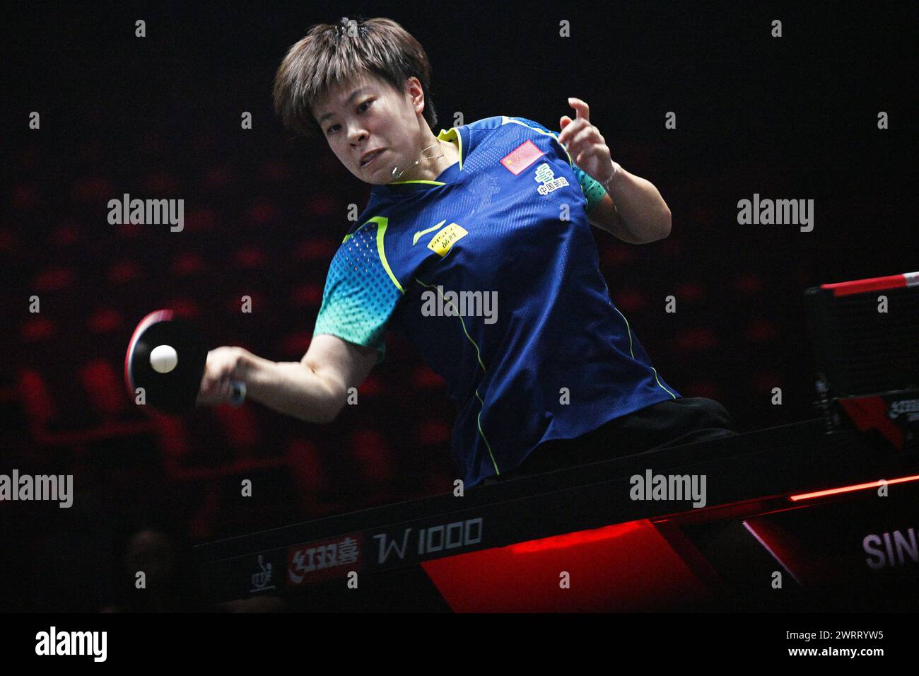 Singapore. 14th Mar, 2024. Wang Yidi of China hits a return during the ...