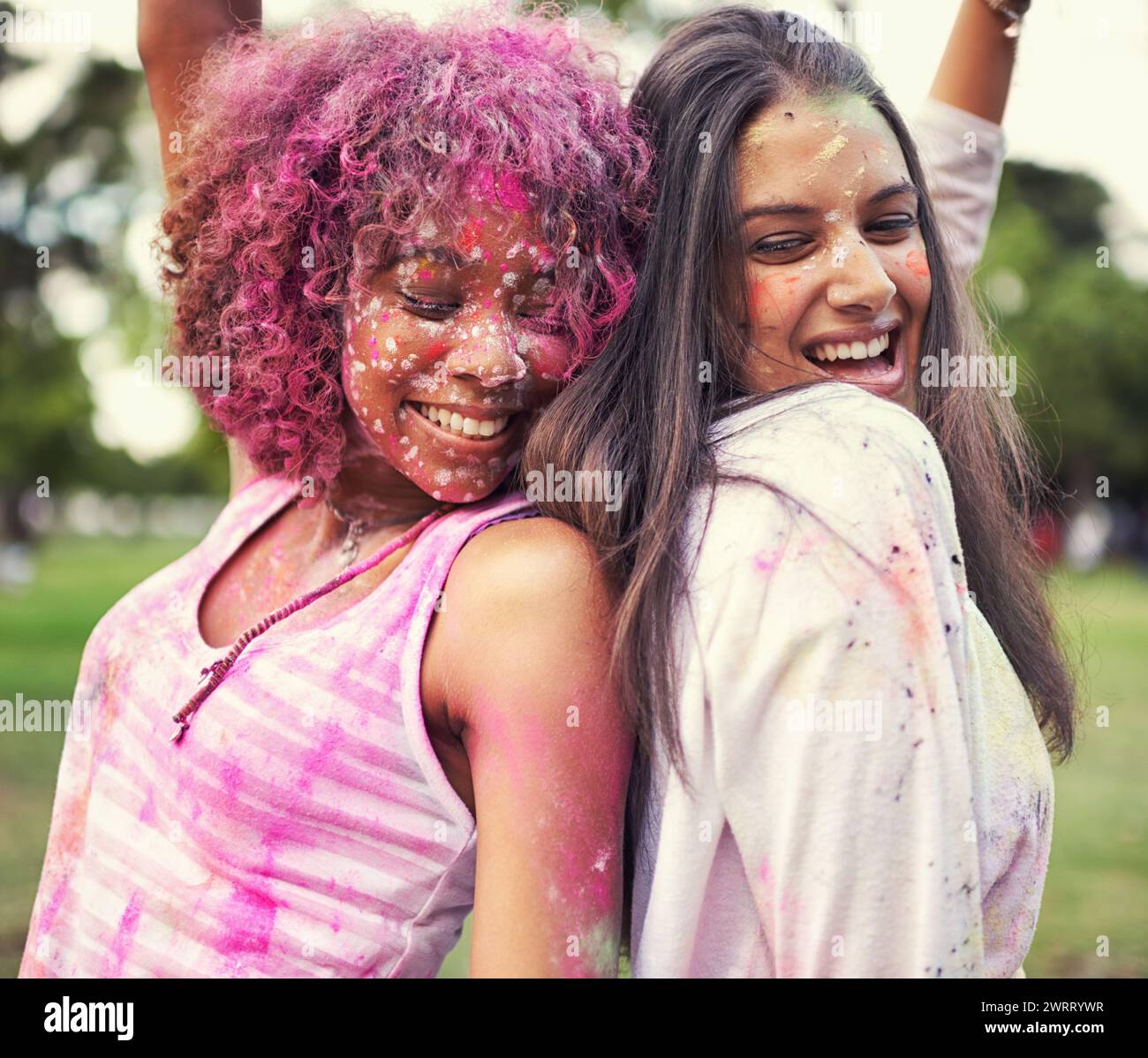 Paint, splash and women dance at color powder festival for fun ...