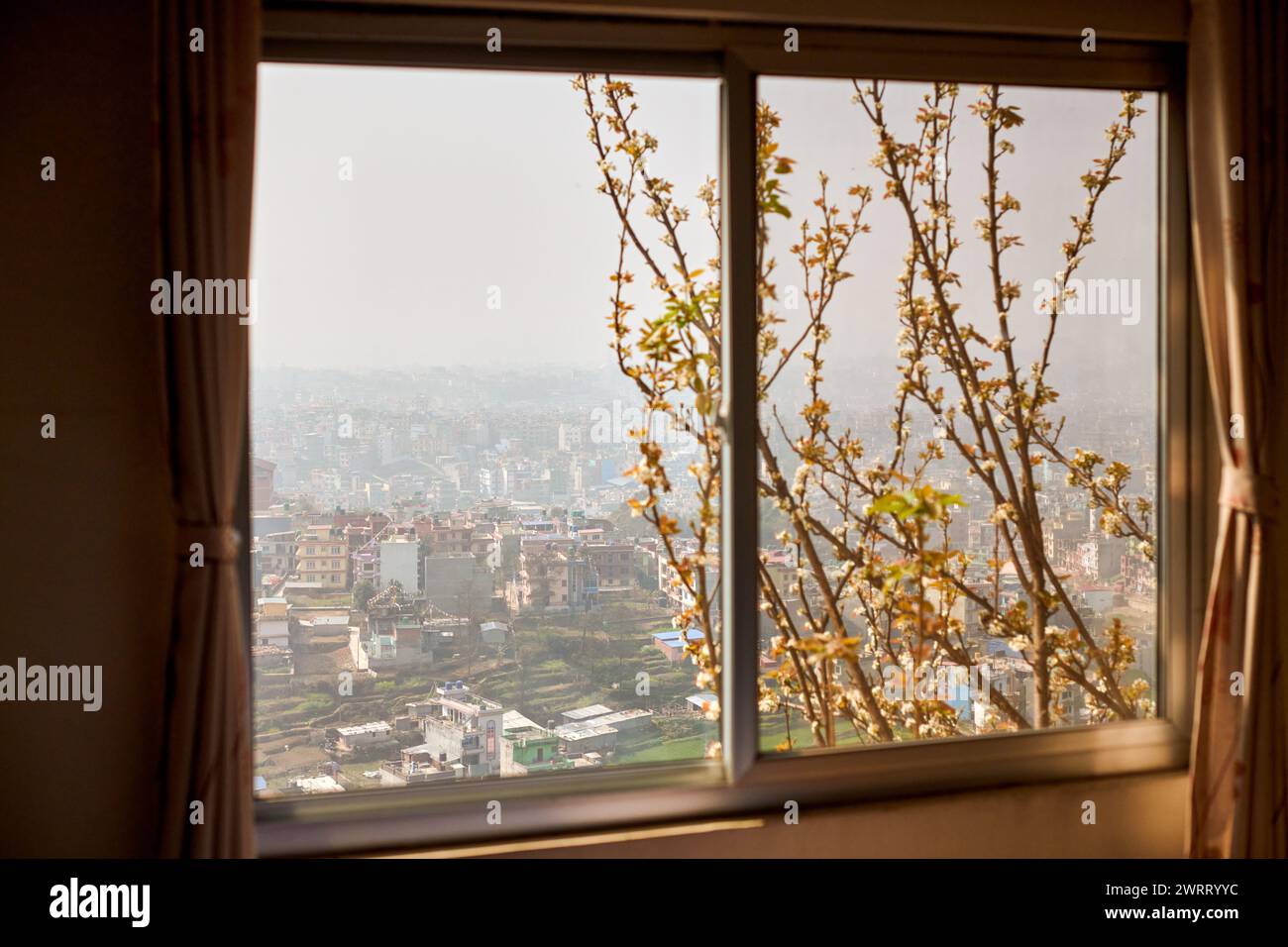View of Kathmandu from hotel window through urban haze with lot of low ...