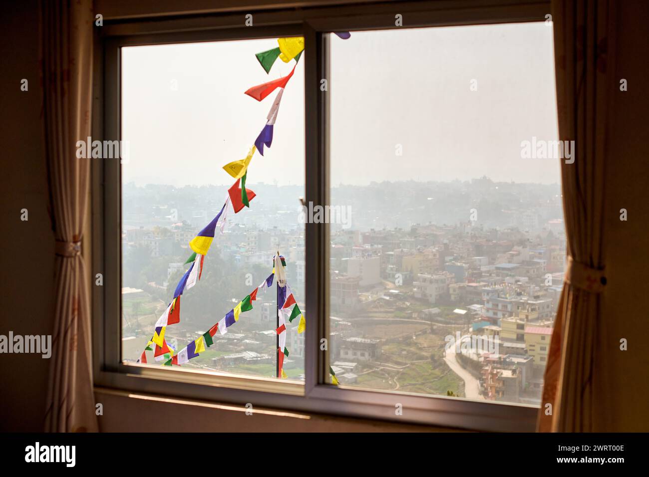 View of Kathmandu from hotel window through urban haze with lot of low ...