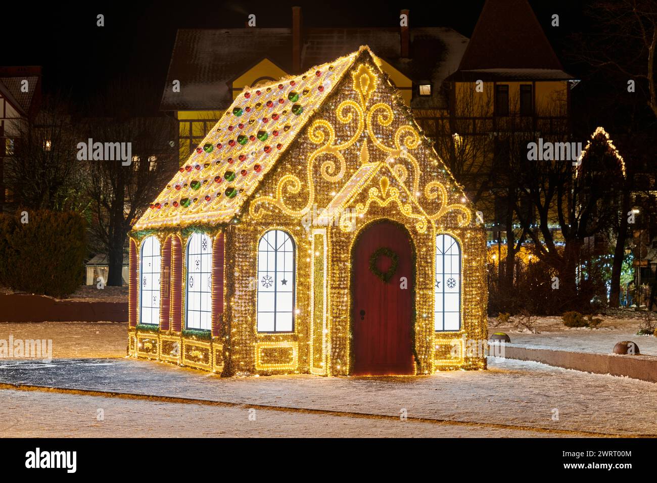 Small fairy tale house decorated with twinkling garlands lights and ...