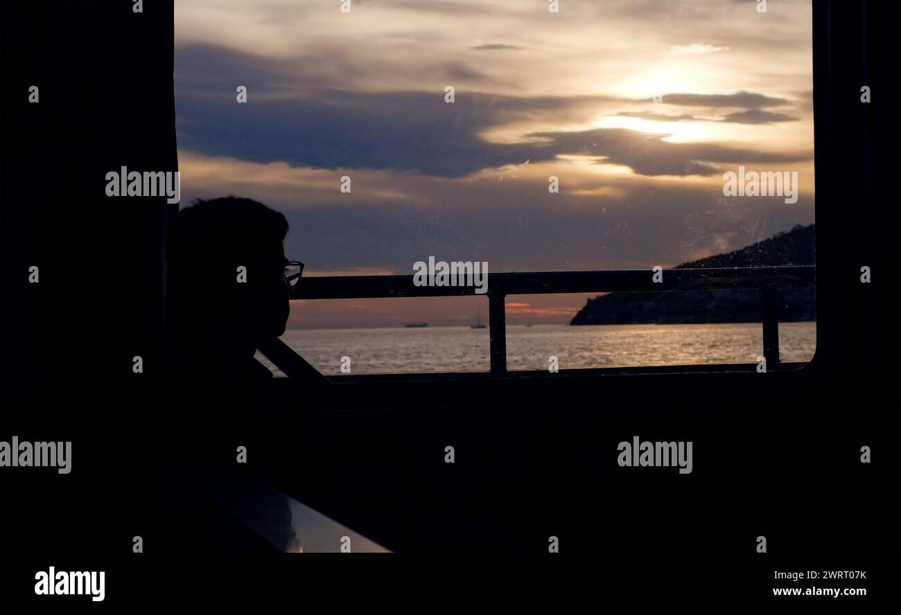 Istanbul, Turkey - 1.7.2024: Silhouette of Young Man Sitting Inside ...