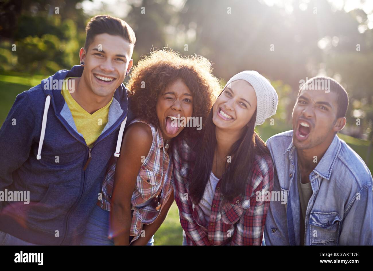 Portrait, funny and group with diversity, sunshine and nature with ...