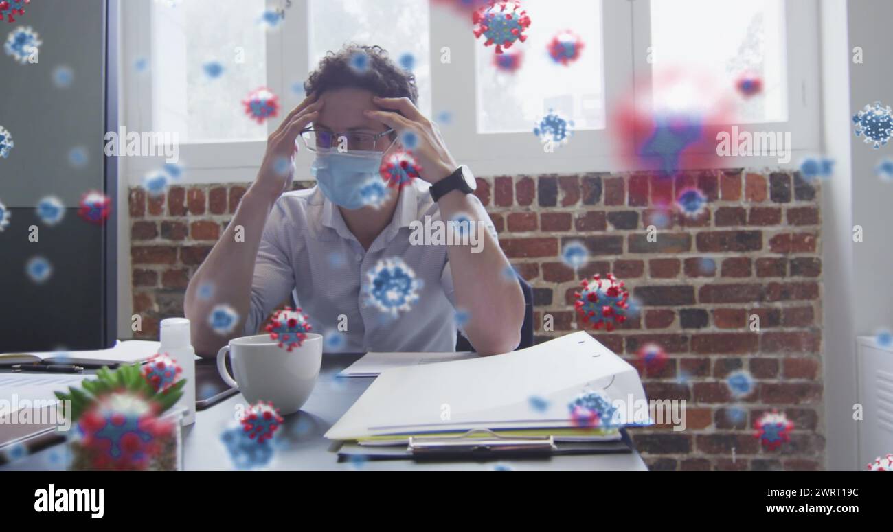 Image of covid 19 cells over stressed man in face mask, holding his ...