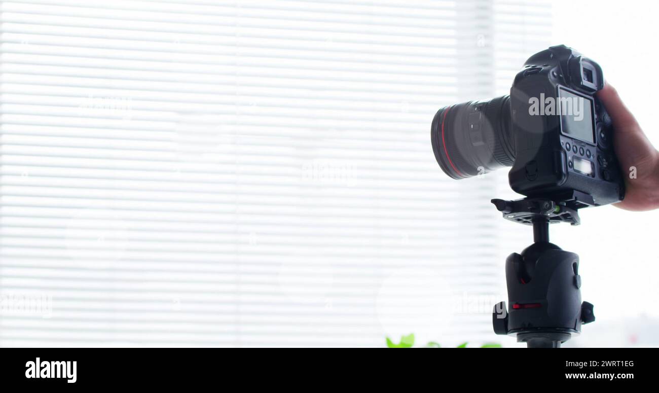 White spots floating against mid section of a man placing a digital ...