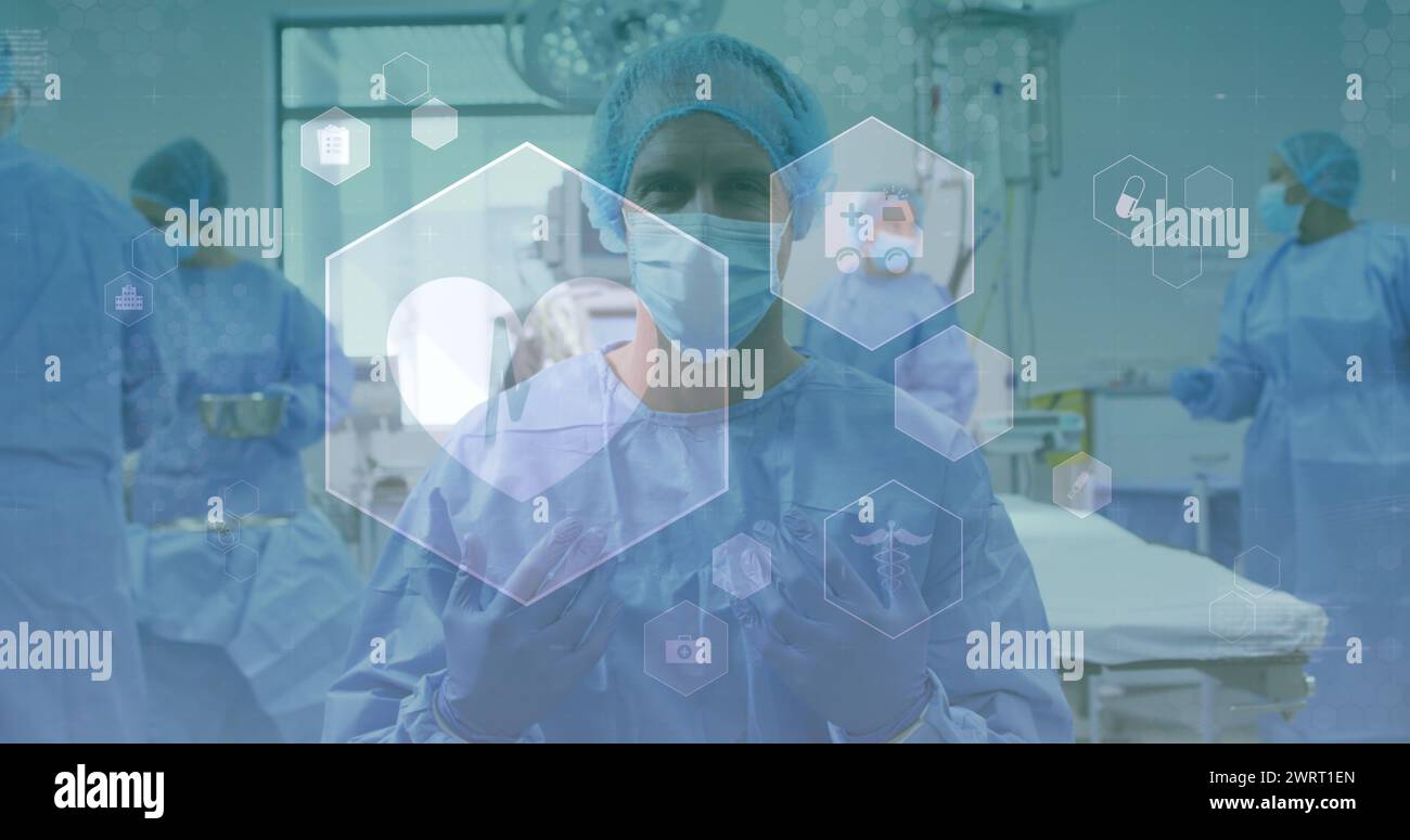 Image of medical icons over diverse surgeons Stock Photo - Alamy