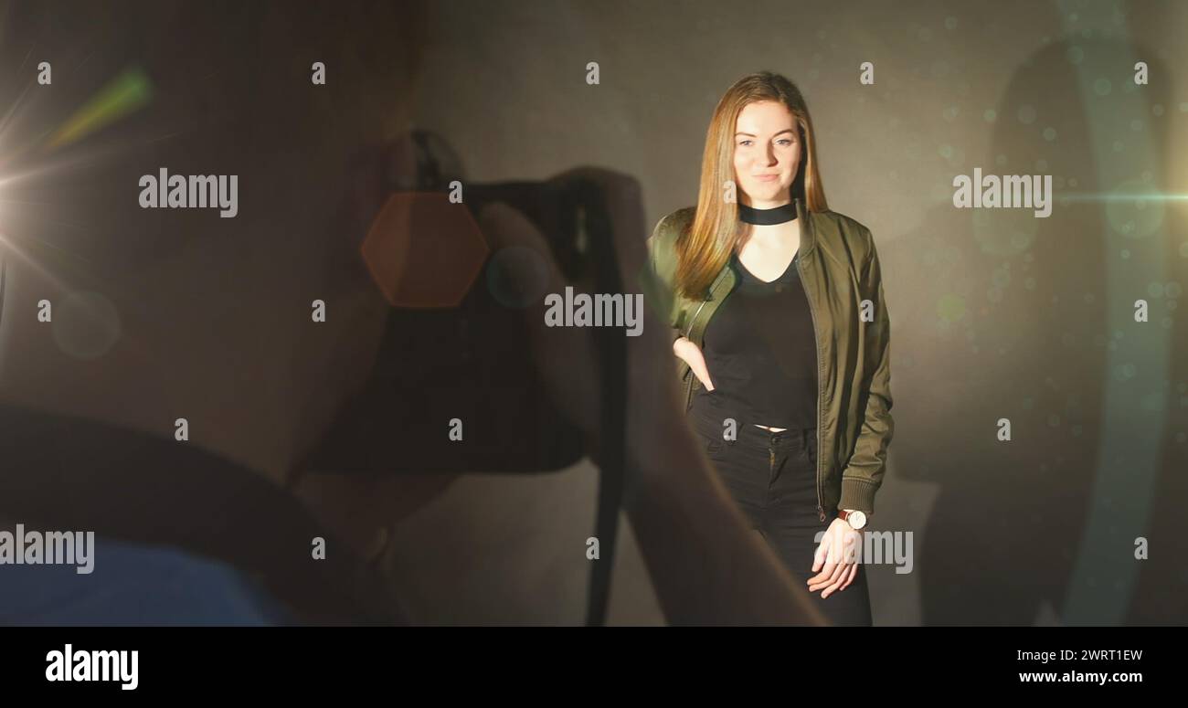 Image of light over caucasian male photographer and female model taking ...