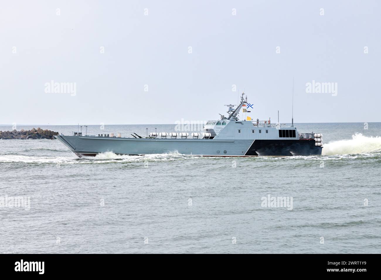 Coast guard ship sails along seaside for safeguarding coastal ...
