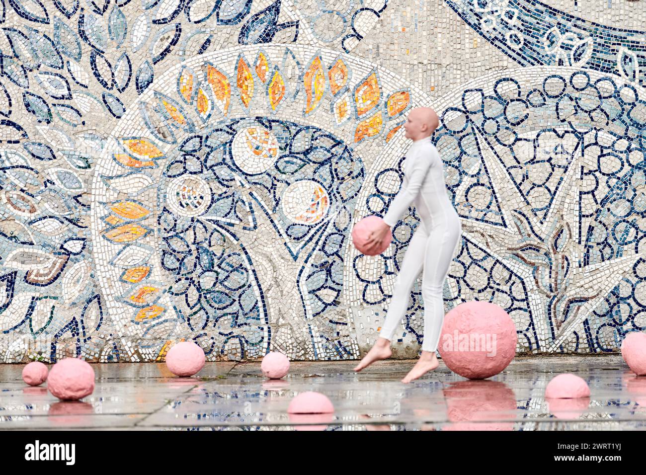 Young hairless girl ballerina with alopecia in white futuristic suit ...