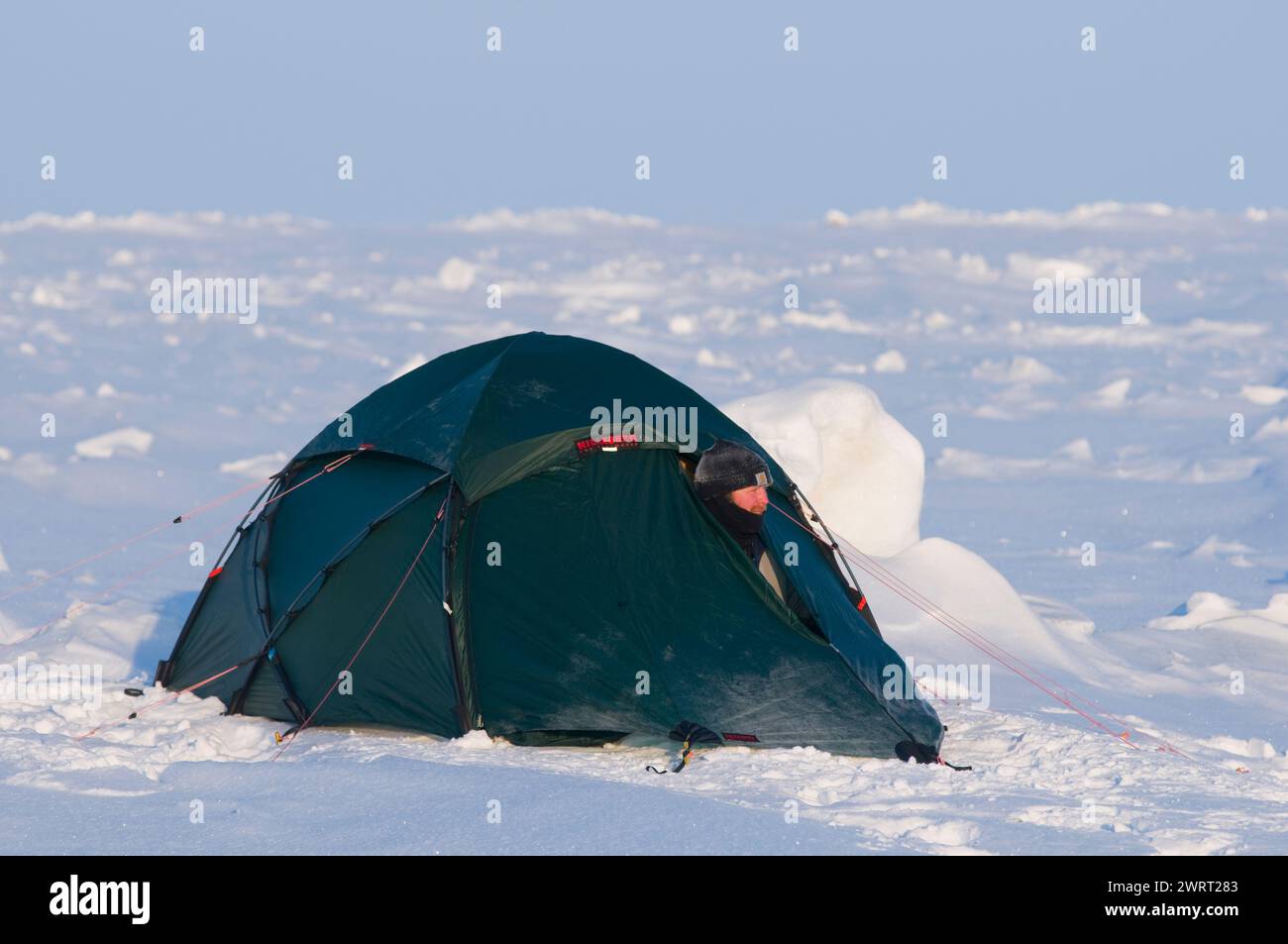 Photographer with camera and Hilleberg tent camped along the arctic ...