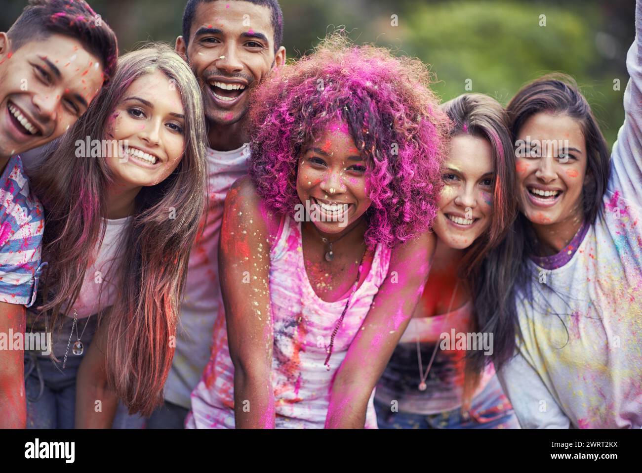 Friends, portrait and powder paint at color festival in park, happiness ...
