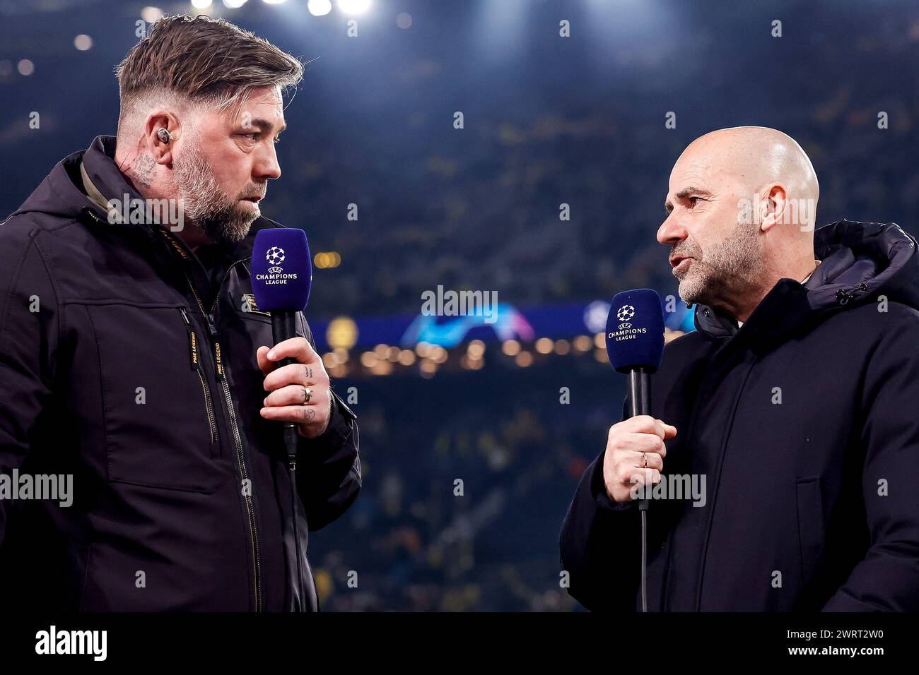 DORTMUND , GERMANY - MARCH 13: Theo Janssen and head coach Peter Bosz ...