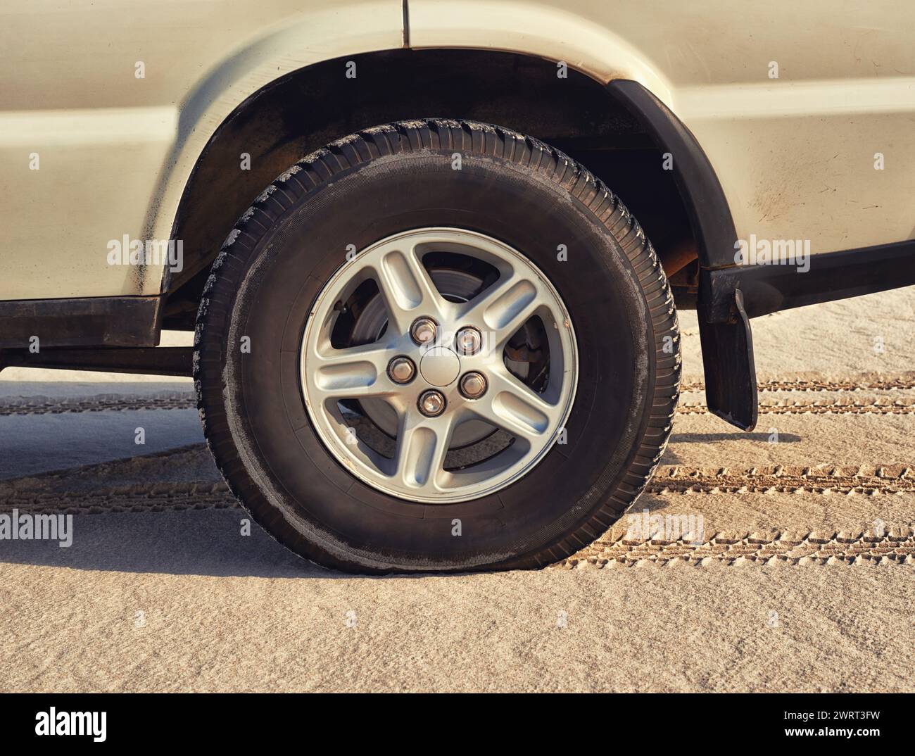Tyre, car in desert and travel with transport outdoor, off road vehicle ...
