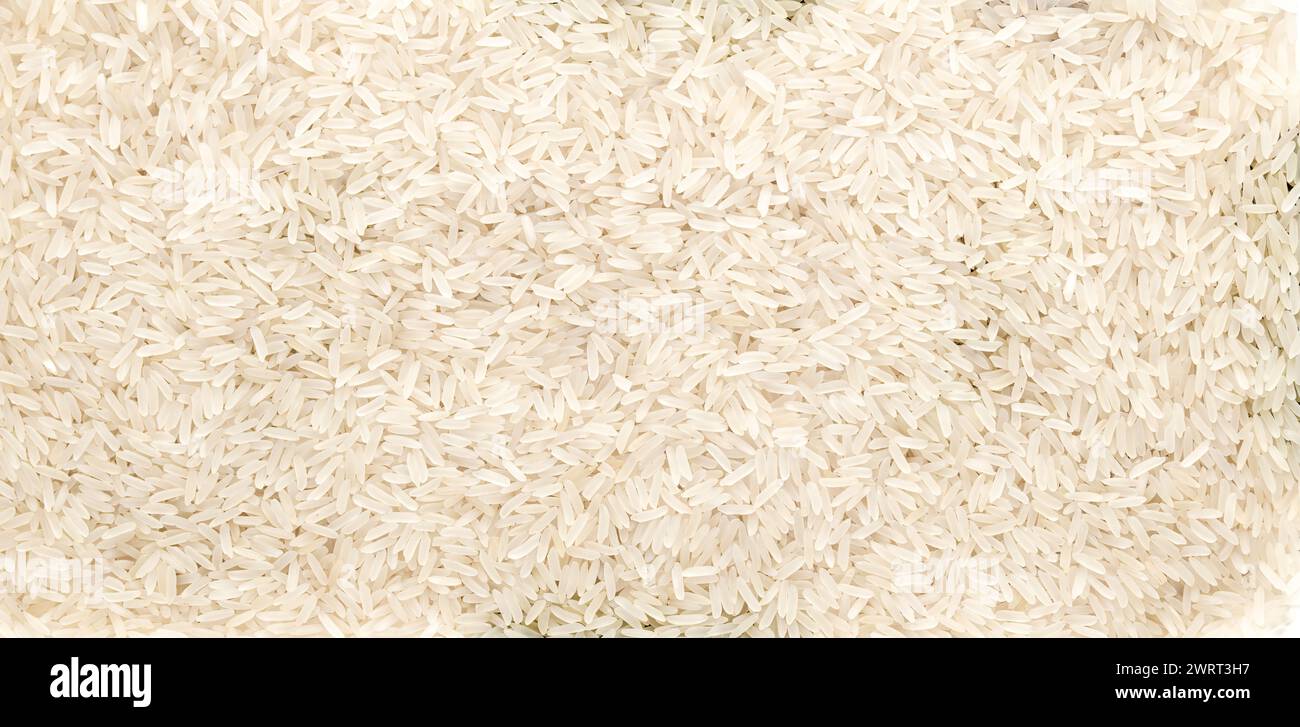 Uncooked white long-grain rice background. Top view. High quality photo ...