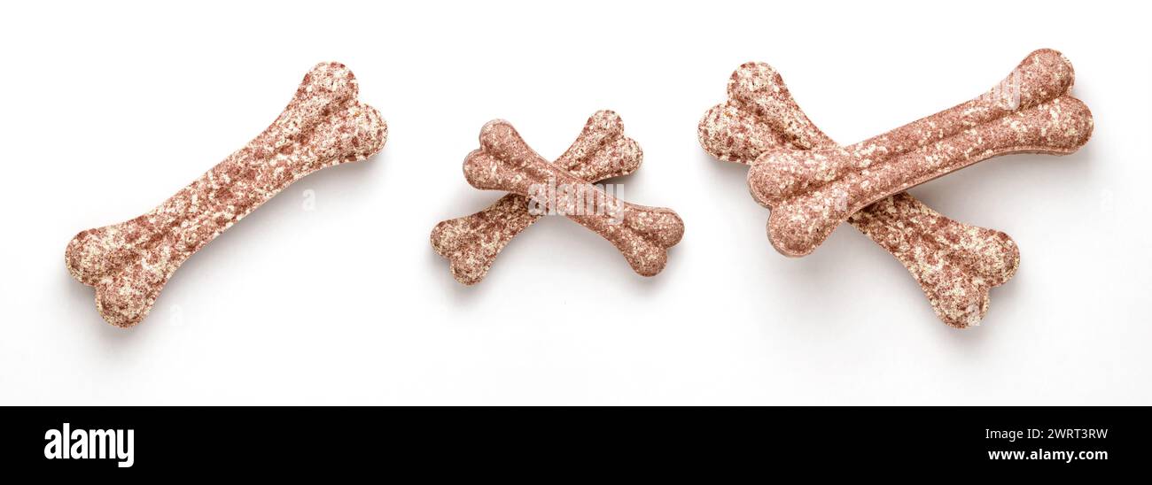 Protein bone for dog, rawhide bone, dog biscuit against a white ...
