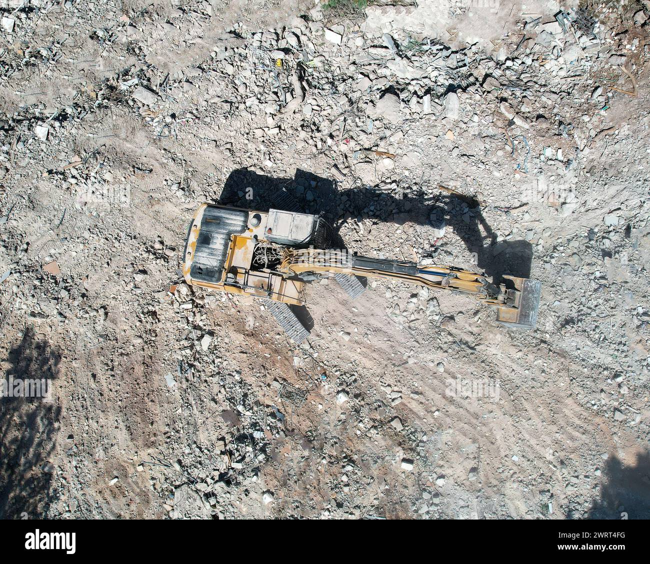Excavator cleaning construction site for a new construction project ...