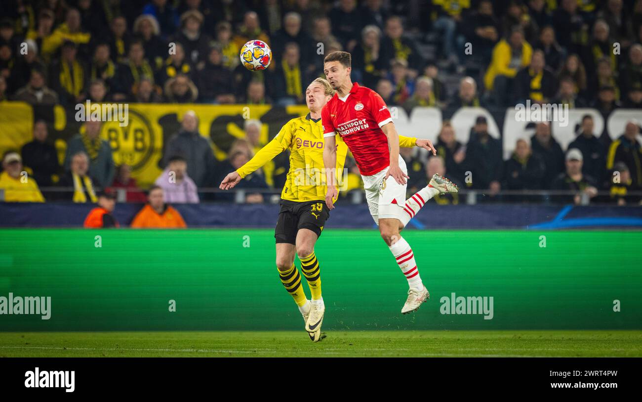 Dortmund, Germany. 13th Mar 2024. Julian Brandt (BVB), Olivier Boscagli ...