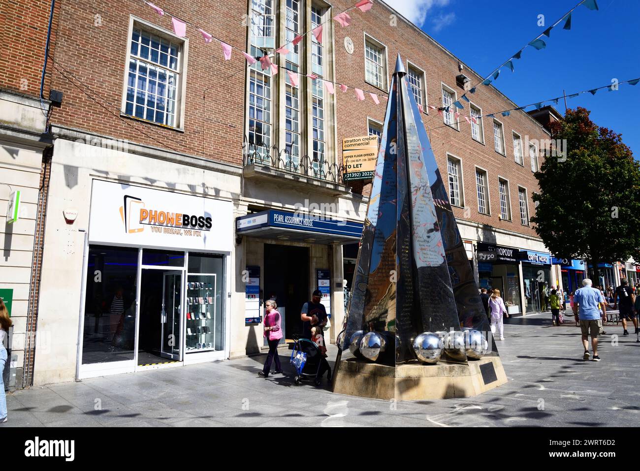 View of the Exeter Riddle sculpture along High Street in the city ...