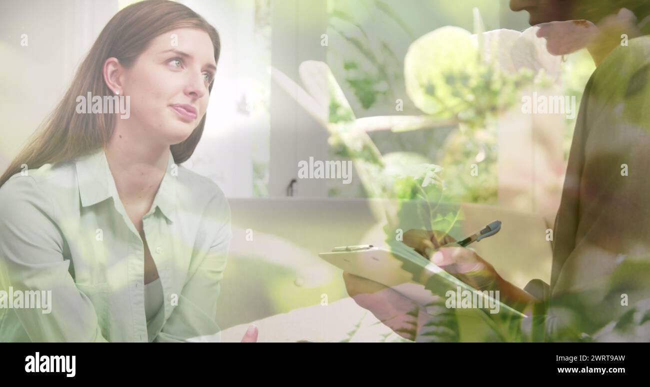 Image of plants over caucasian woman consulting psychologist Stock ...