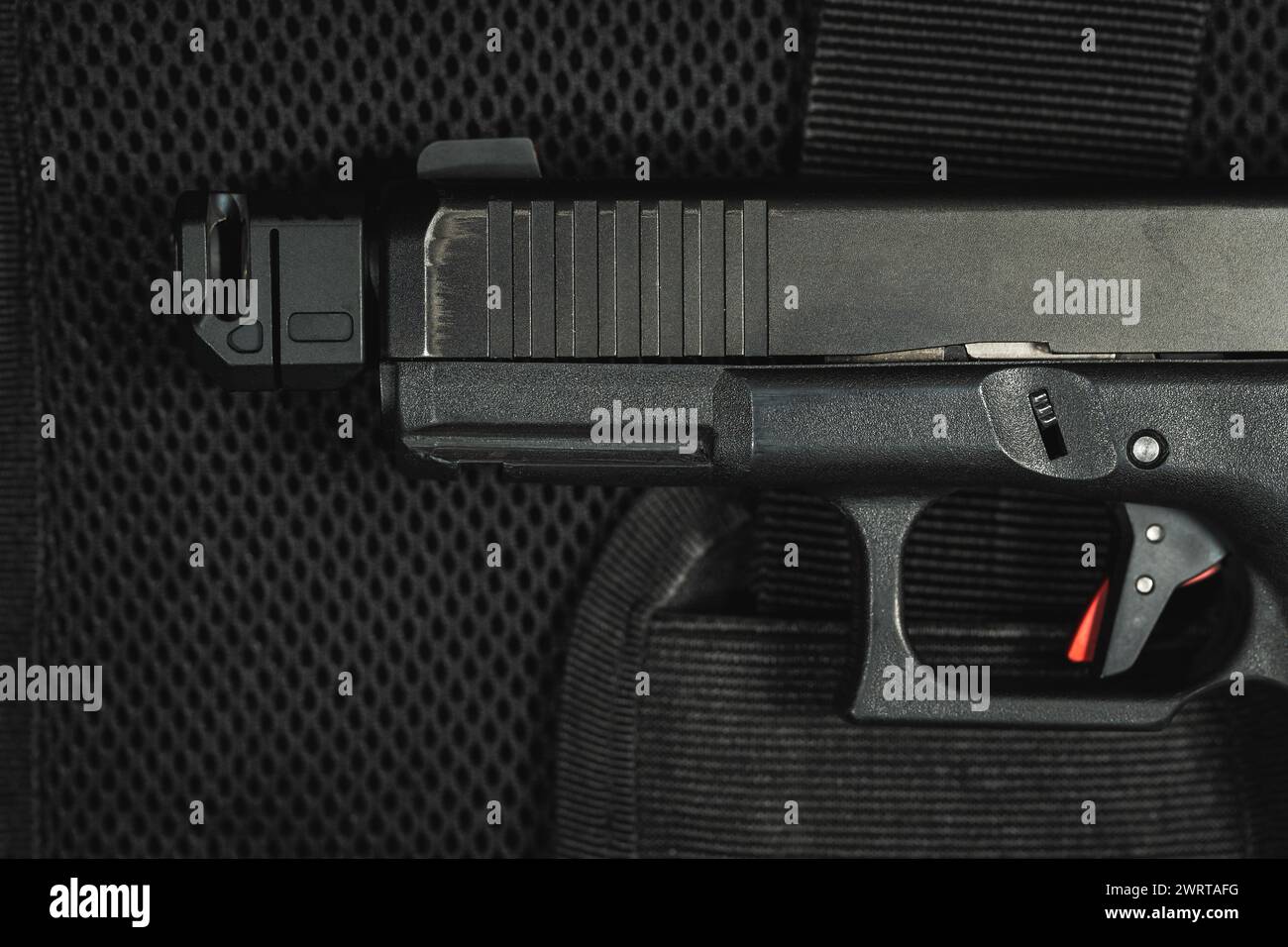 Modern 9 mm pistol with a muzzle brake, close-up photo Stock Photo - Alamy