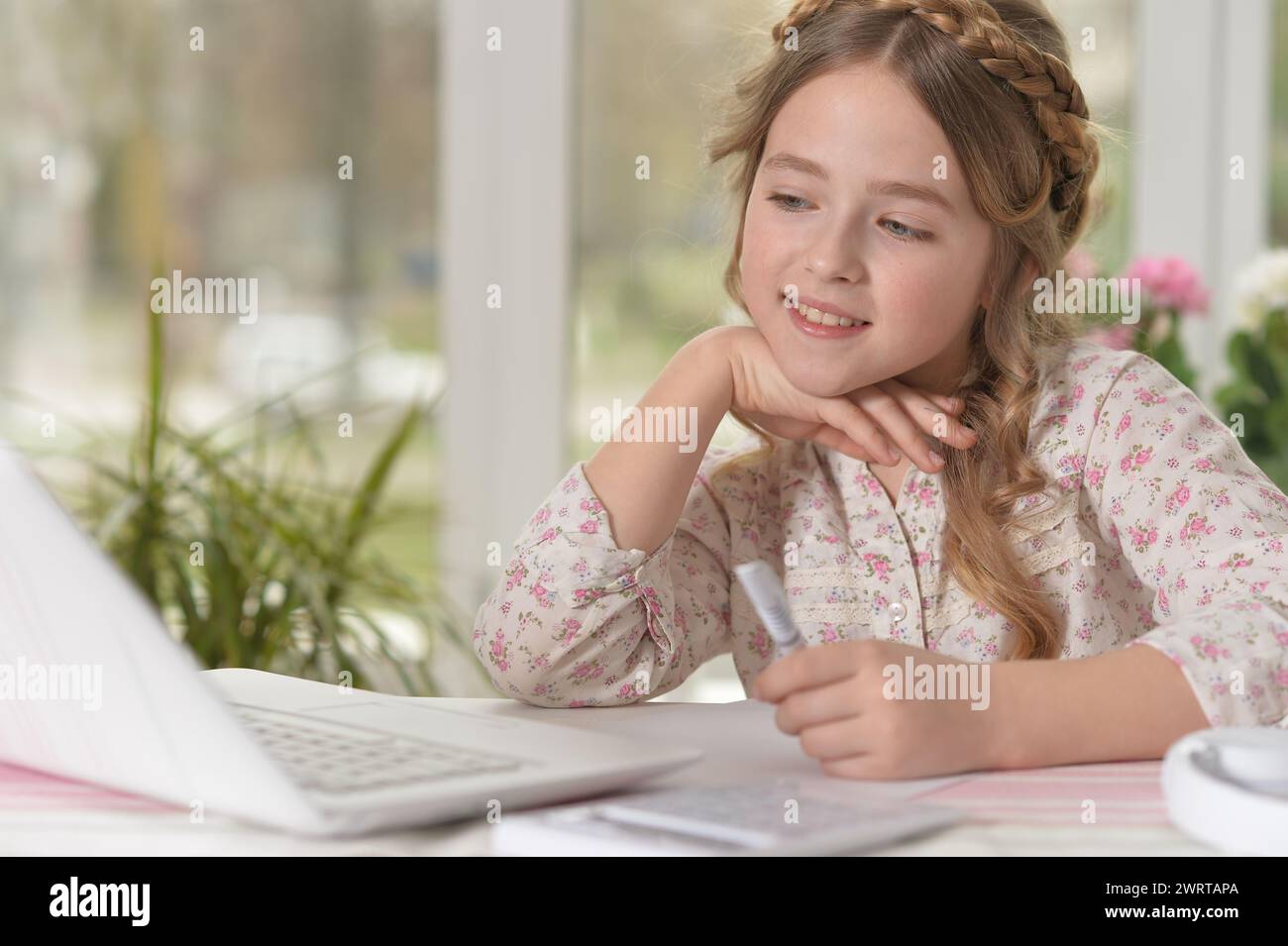 Cute and happy little girl children using laptop computer Stock Photo ...