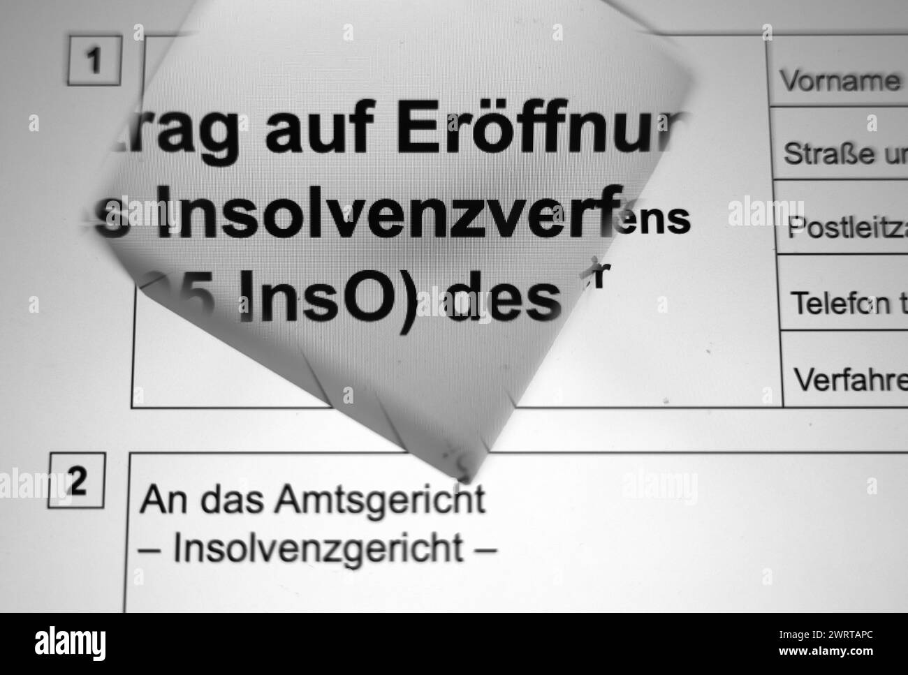 Cologne, Germany. 13th Mar, 2024. ILLUSTRATION - A magnifying glass is ...