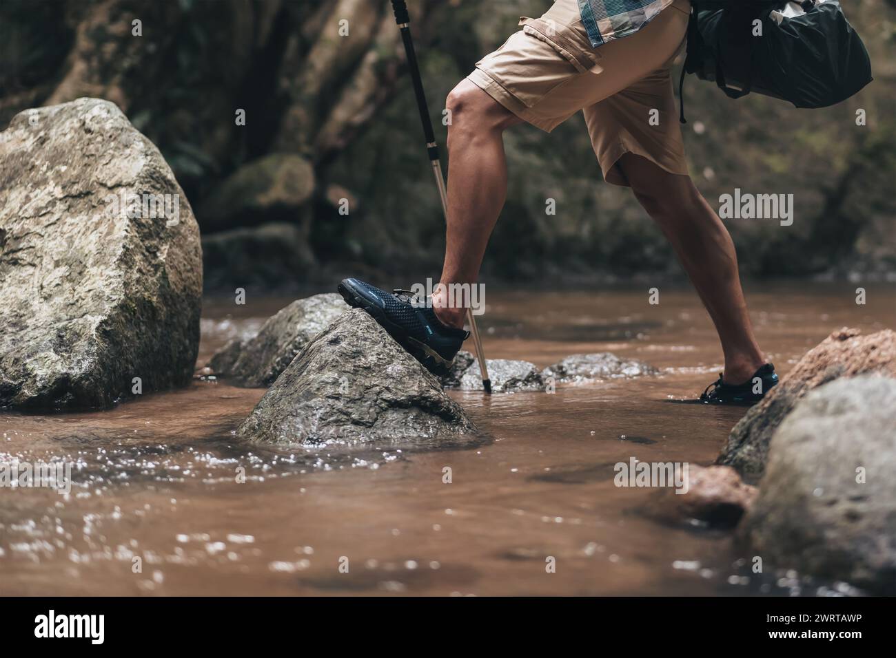 Hikers use trekking pole with backpacks walking through the rock and ...