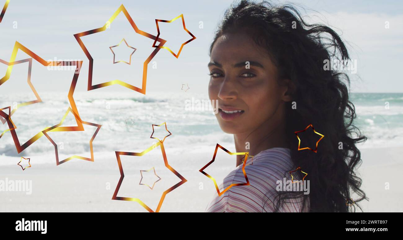 Image of stars over biracial woman at beach Stock Photo - Alamy