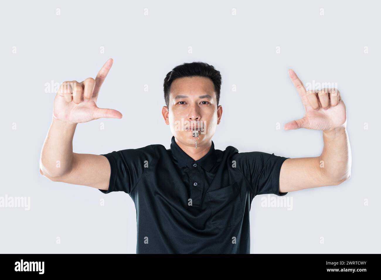 Football referee showing VAR symbol on white background Stock Photo - Alamy