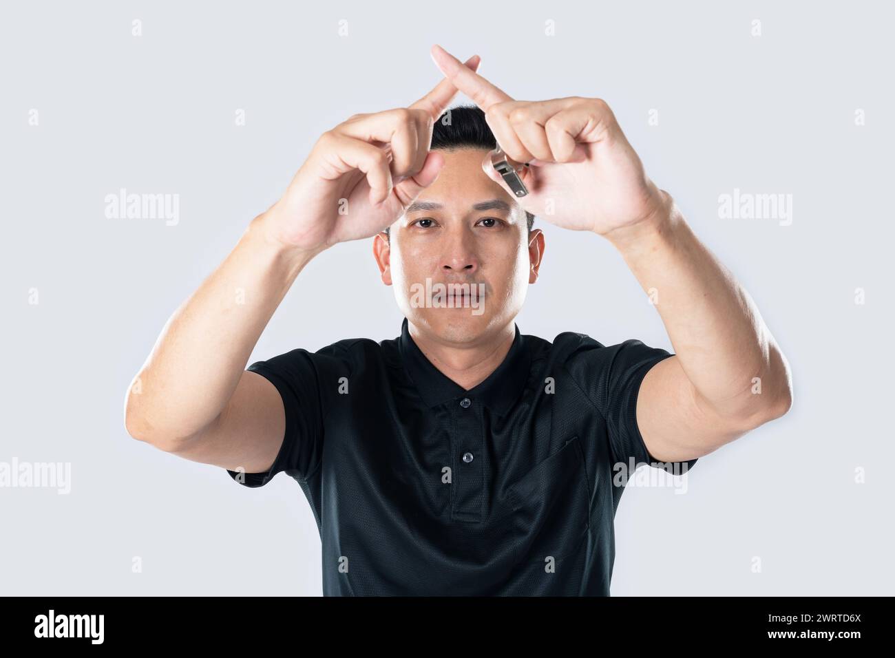 Football referee showing VAR symbol on white background Stock Photo - Alamy