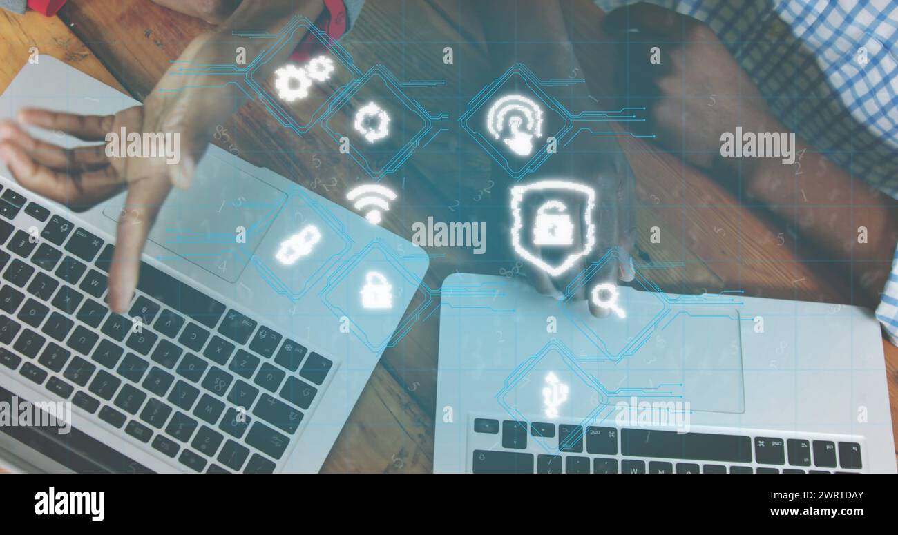 Image of icons over diverse people using laptop Stock Photo - Alamy
