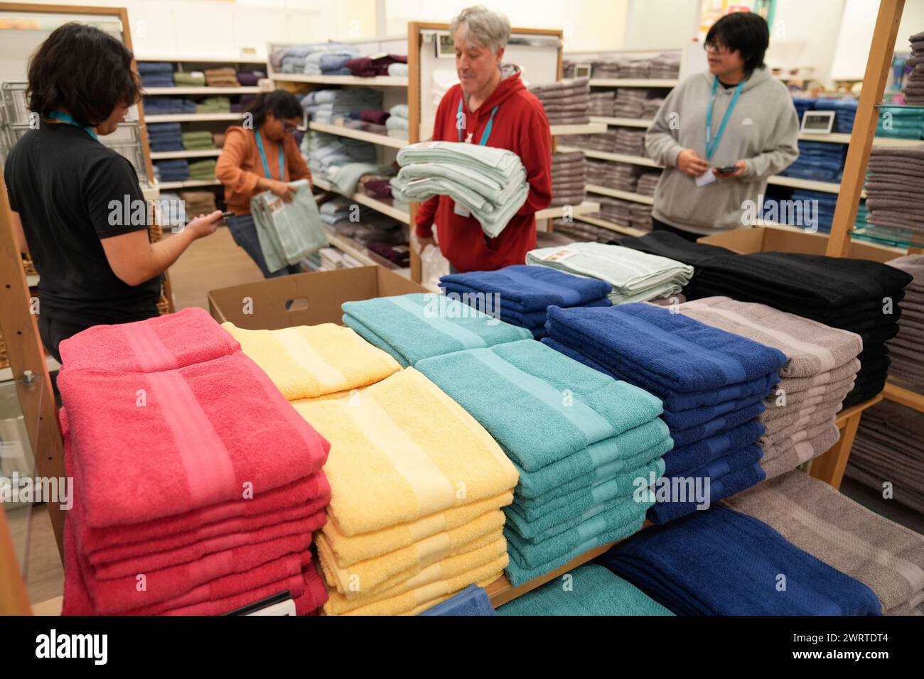 FILE - Employees arrange a display at a Kohl's store in Clifton, N.J ...