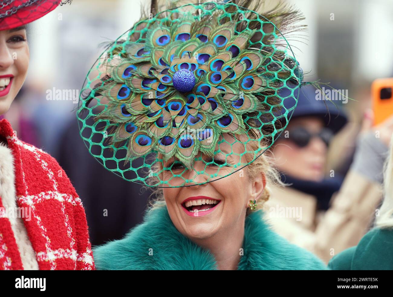 A racegoer arrives on day three of the 2024 Cheltenham Festival at ...