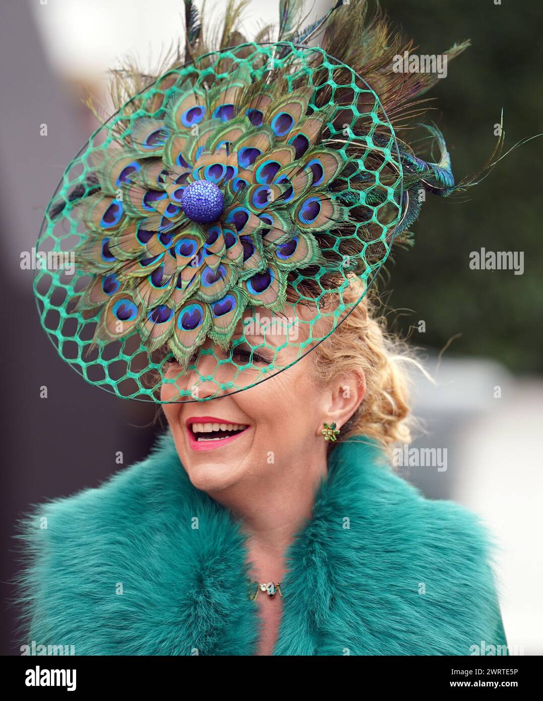 A racegoer arrives on day three of the 2024 Cheltenham Festival at ...