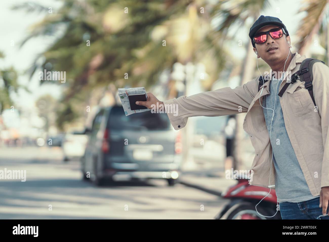 Tourists hold maps and hitchhiking. backpacker and travel concept Stock ...