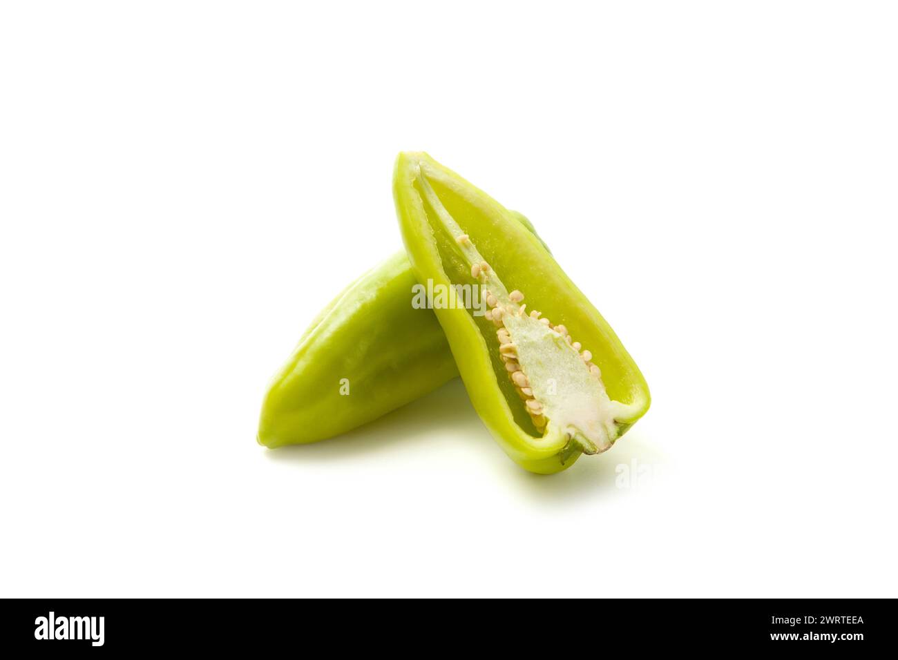 Whole and half of green bell pepper (capsicum) known as sweet bell ...