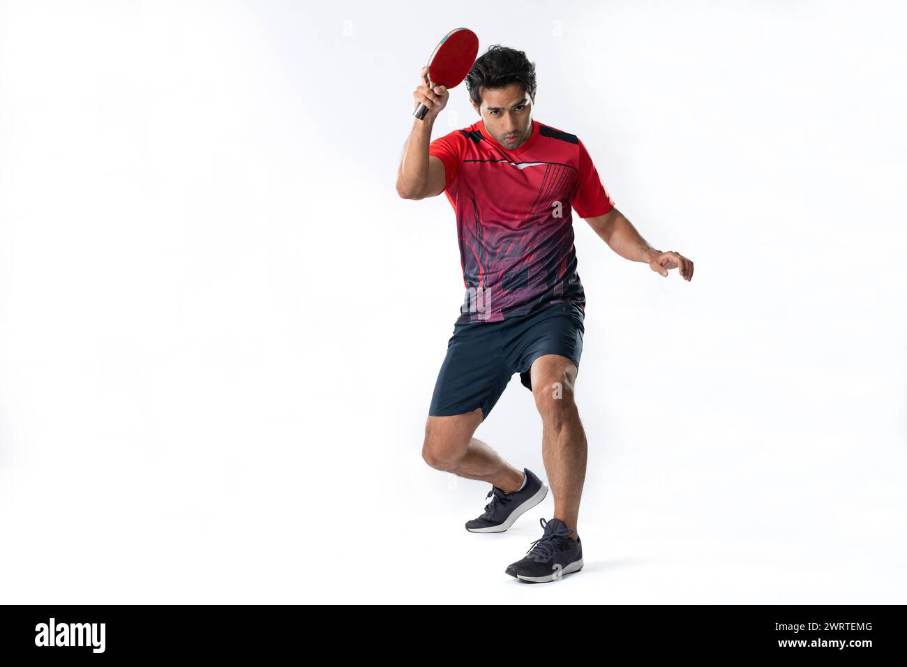 Portrait of sports man male athlete playing table tennis isolated on ...