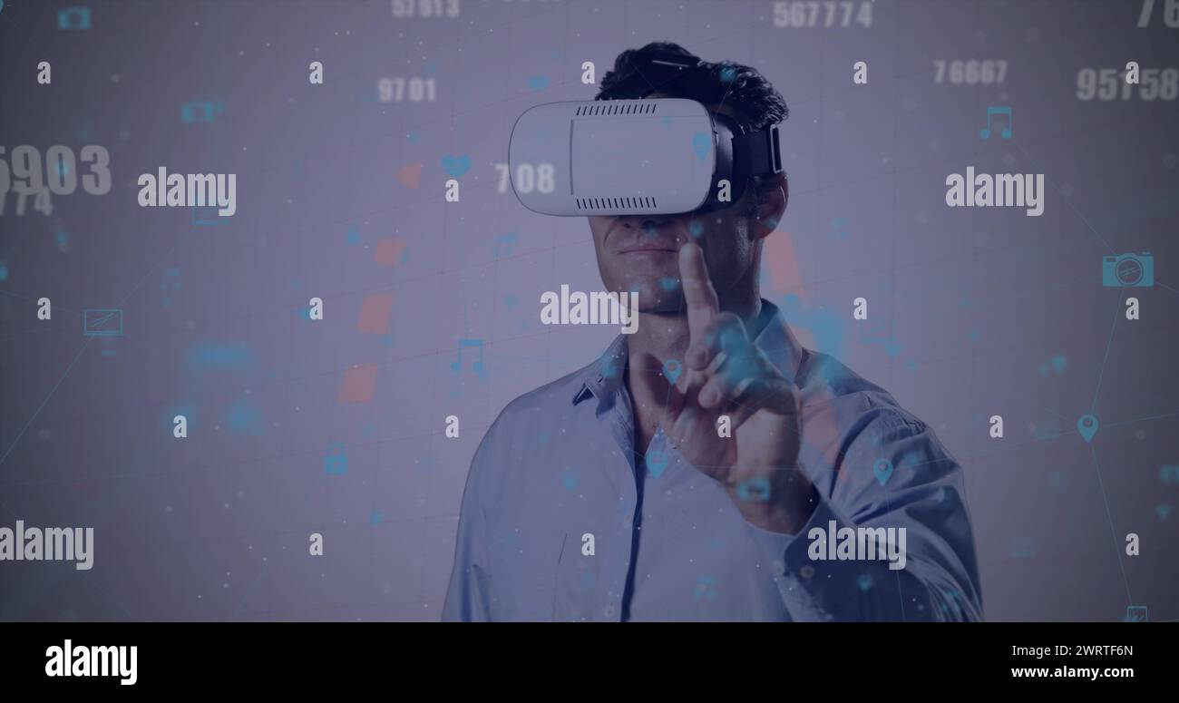 Image of data processing over men using vr headset Stock Photo - Alamy