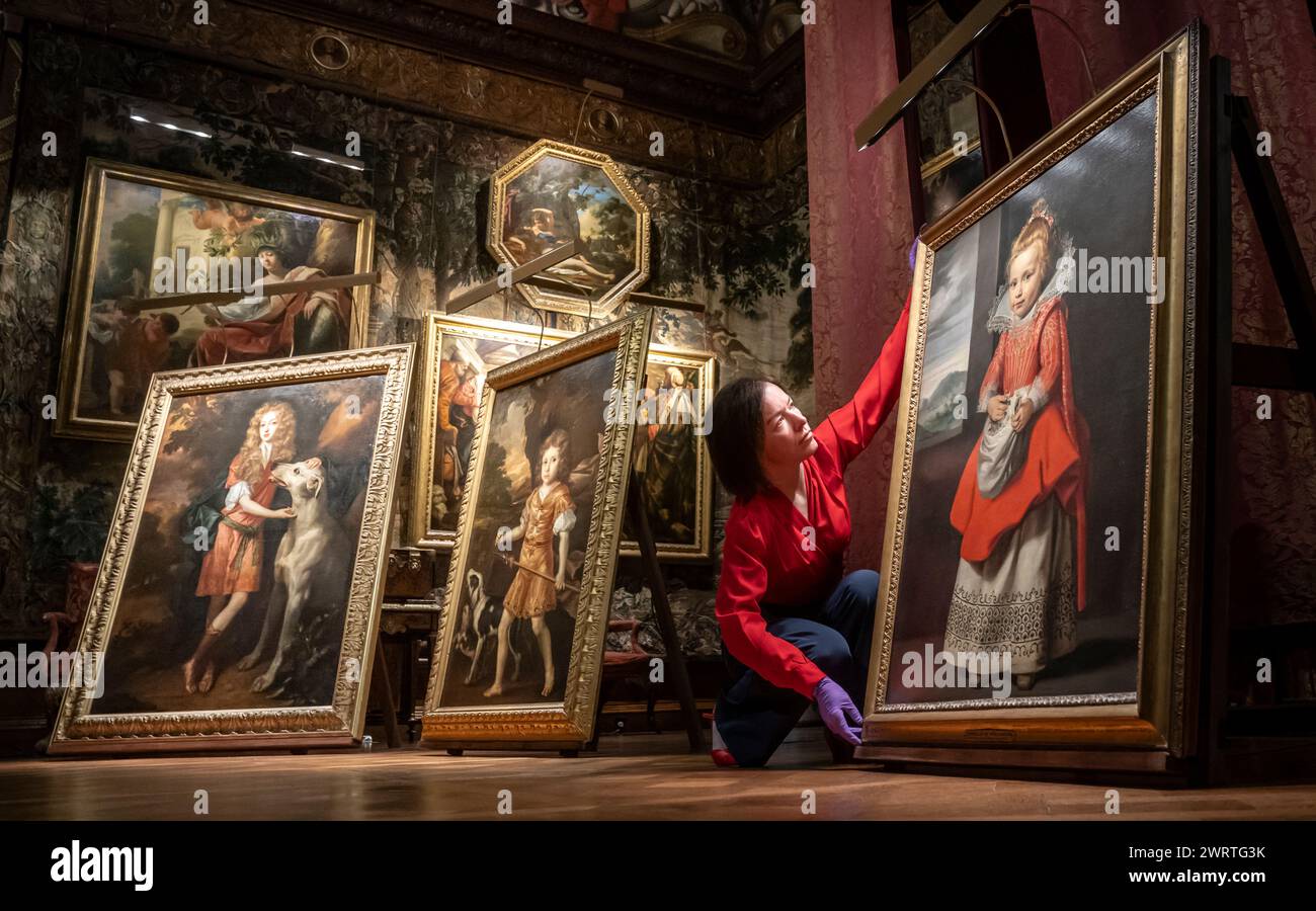 Curator Gill Hart puts the finishing touches the Picturing Childhood ...