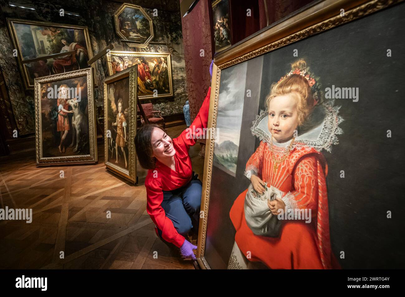 Curator Gill Hart puts the finishing touches the Picturing Childhood ...