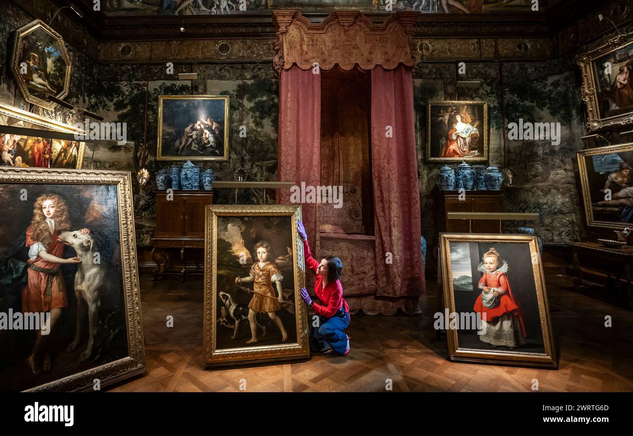 Curator Gill Hart puts the finishing touches the Picturing Childhood ...