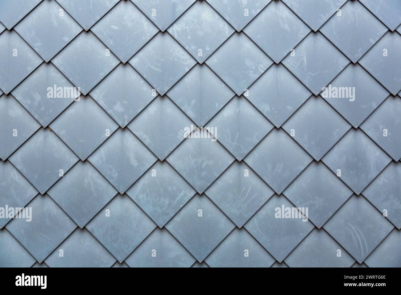Diamond shaped fish scale tiled wall texture background close up Stock ...