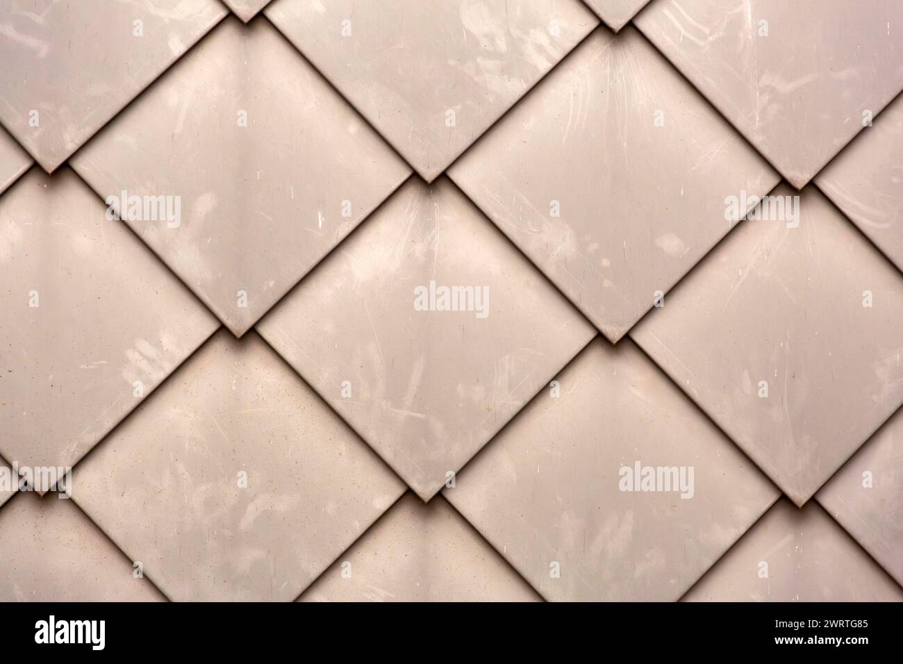 Diamond shaped fish scale tiled wall texture background close up Stock ...