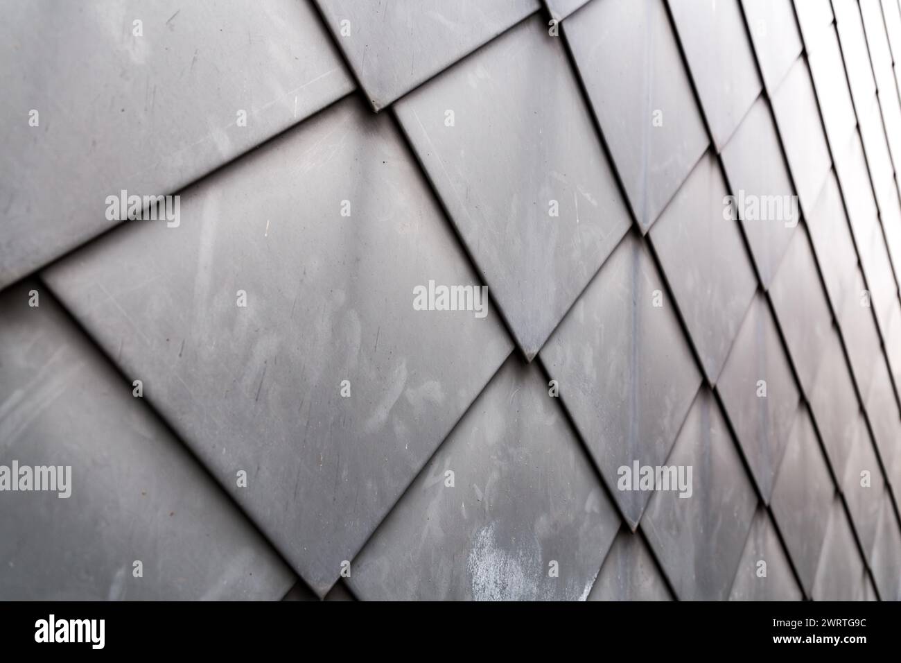 Diamond shaped fish scale tiled wall texture background close up Stock ...