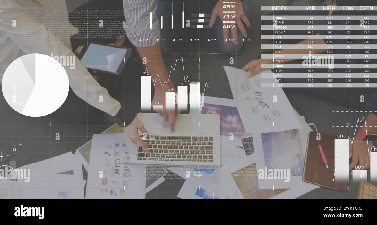 Image of people using a laptop computer in a busy office with white ...