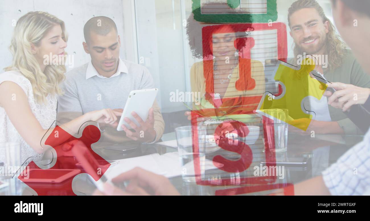 Image of colourful puzzle pieces and autism text over work colleagues using tablets Stock Photo ...