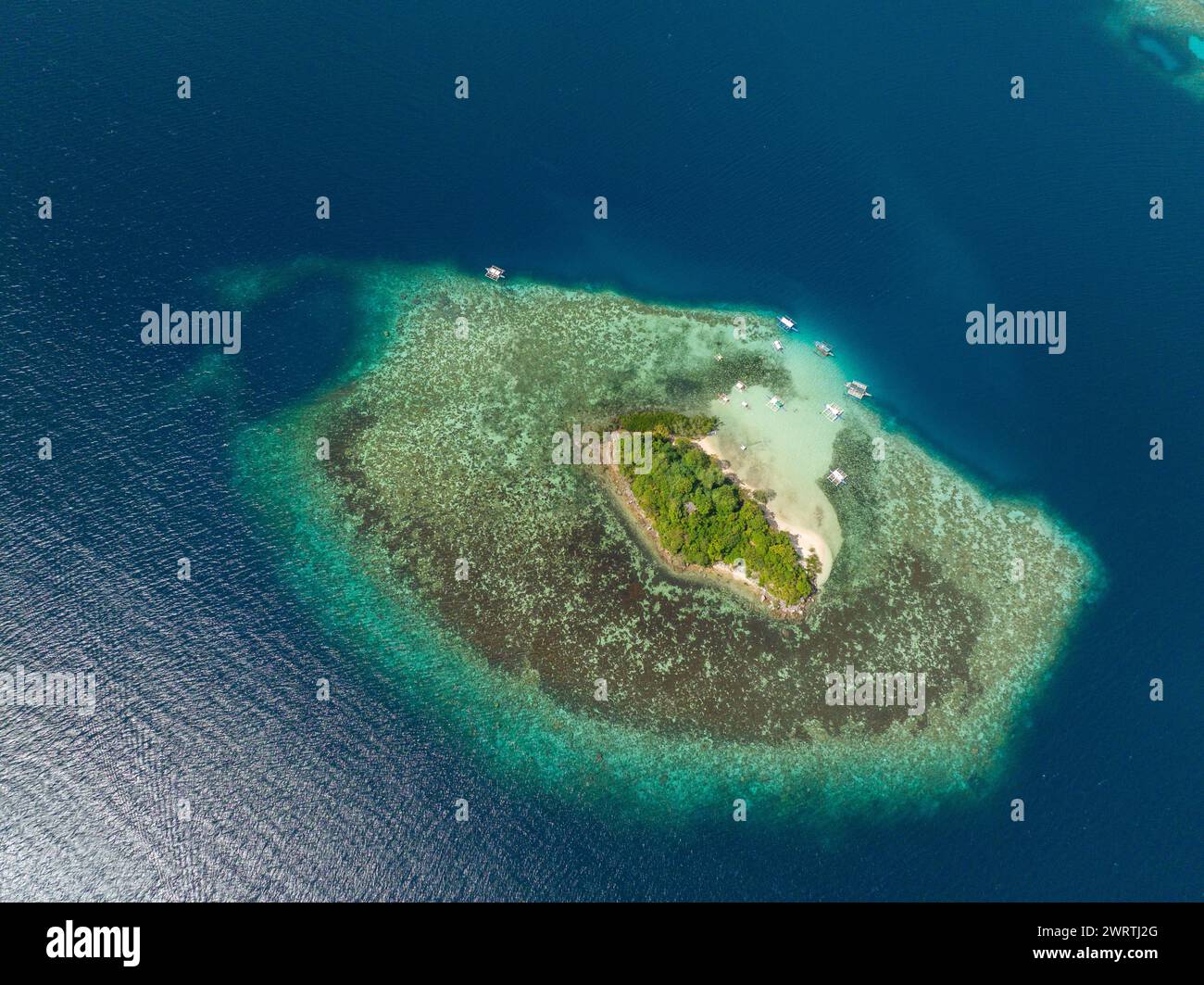 CYC Beach with white sand and boats over clear sea water with sun ...