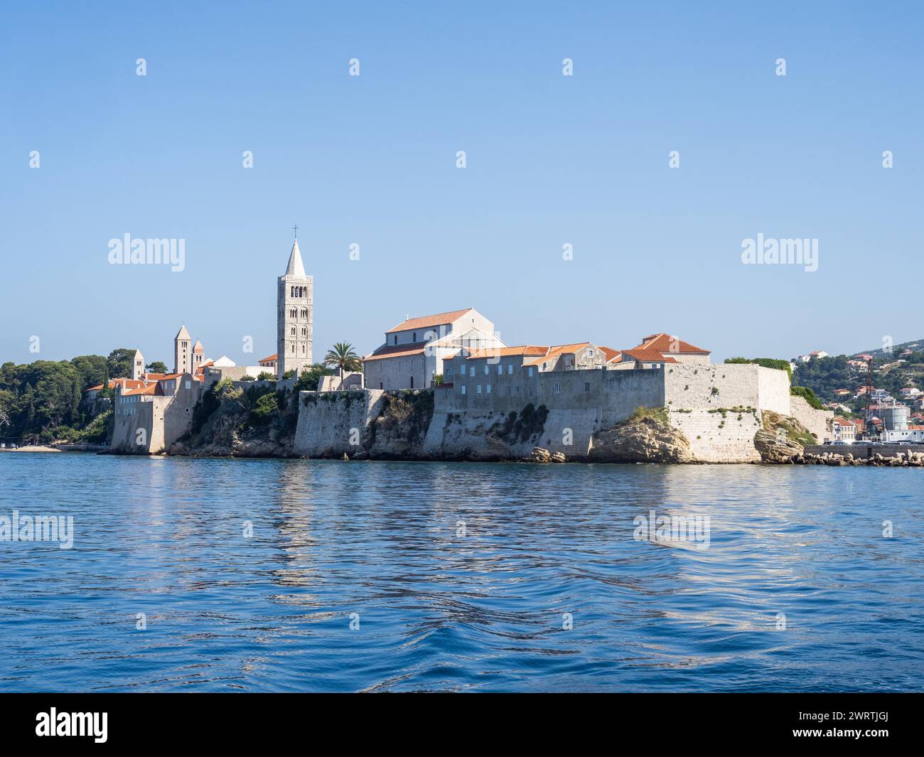 Town of Rab in the morning light, church towers seen from the sea, Rab ...