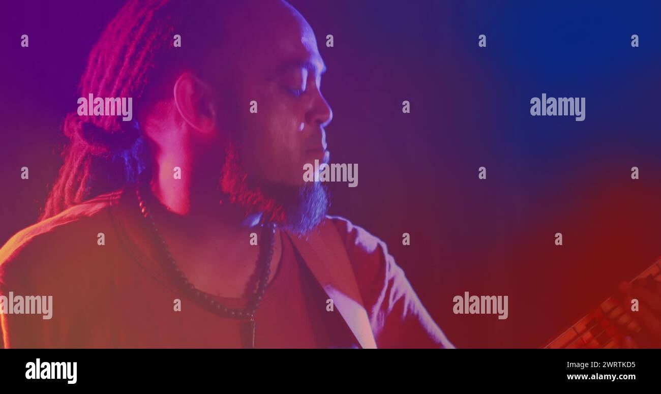 Image of red and blue light blurs over african american man with ...