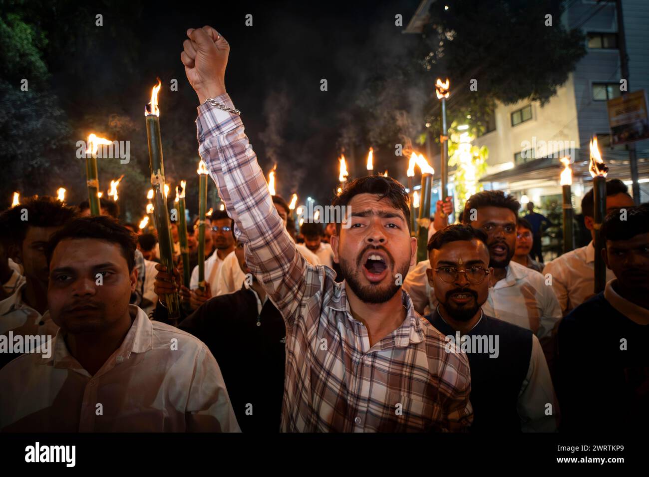 Members of the All Assam Students' Union (AASU) take part in a flaming ...